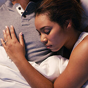 Couple, hug and sleep in bed at house for relax, love and fatigue ...