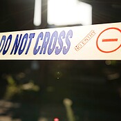 Crime scene, police tape and danger in building for investigation with ...