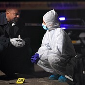 Men, detective and talking at crime scene for forensic assessment for ...