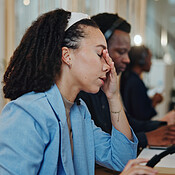 Woman, employee and tired at office with headache, exhausted and ...