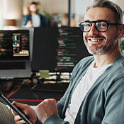 Programmer, happy businessman and portrait with tablet for software ...