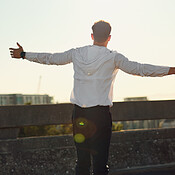 Back, open arms and man with training, outdoor and celebration with ...