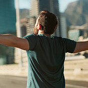 Back, open arms and man with fitness, outdoor and celebration with ...