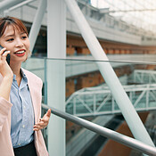Japanese, business and woman with phone call in office of civil ...