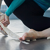 Injury, legs and dancer in studio, hands and fracture on ankle, joint ...