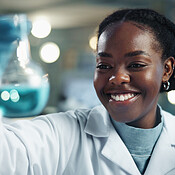 Scientist, black woman and beaker with smile for biochemistry ...