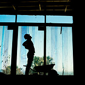 Construction, person and engineer with back pain, hurt and silhouette ...