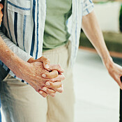 Physiotherapy, holding hands and patient with cane for support ...