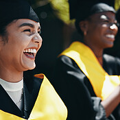 Woman, excited and students at university for graduation, peer support ...