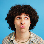 Man, face and pout with afro for kiss, flirty expression or dream in ...