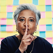 Sticky note, secret and portrait of business woman in studio for ...