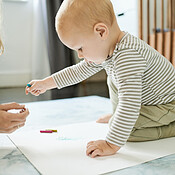 Mother, baby and learning drawing in home on paper, bonding and ...