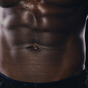 Abs, muscles and torso of black man in studio with sweating for ...