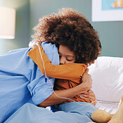 Doctor, child and hug for check up, fear and hospital support for ...