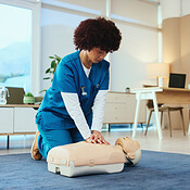 Nurse, cpr or woman training on mannequin for first aid practice ...