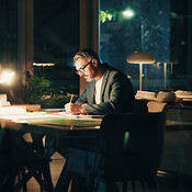 Architecture, night and business man in office for urban planning ...