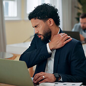 Office, businessman and neck pain with laptop for typing, muscle ...