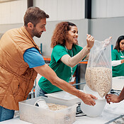 Volunteer, people and packing food for donation with community service ...