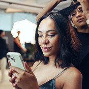 App, phone or photography with hair stylist and model in studio for behind the scenes ...