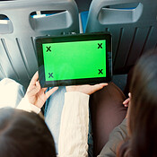 Hand, people and tablet with green screen in bus, travel and user ...