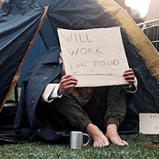 Person, homeless and cardboard for begging with cup, poverty and ask ...
