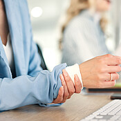 Hands, business and woman in office, wrist pain and inflammation with ...