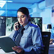 Phone call, security guard and woman with tablet, display or cctv ...