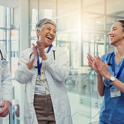 Nurse, doctor and applause for clinic success with healthcare recognition, medical excellence ...