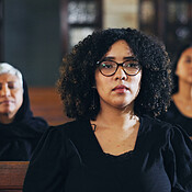 Funeral, sad and woman in church, mourning and praying for loss ...
