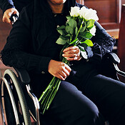 Funeral, grief and person with wheelchair at church, mourning and ...