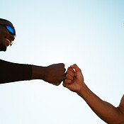 Fitness, people and fist bump in city for support, team achievement and ...