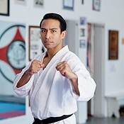 Portrait, man and karate in dojo for self defense training, challenge or skill with martial arts ...