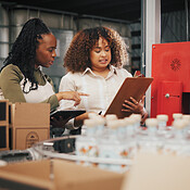 Distillery, team and inspection with women in factory for packaging ...