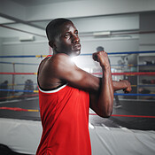 Stretching, boxer and training with black man in gym for mma fighter ...