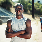 Portrait, active and black man with pride at stadium for exercise ...