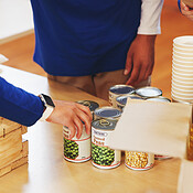 Food, help and hands of volunteers with donation for community service ...