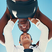 Huddle, running and teamwork with friends in city for support, fitness ...