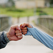 Friends, fitness and fist bump with hands outdoor for greeting, hello ...