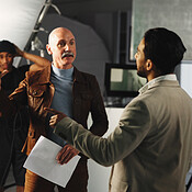 Talking, actor and director on set for production, filming and shooting ...