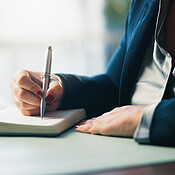 Journal, business woman and hands writing notes with schedule, to do ...