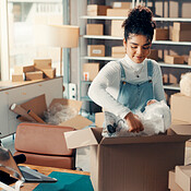 Box, packing and supply chain with woman in office for small business delivery or distribution ...