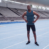 Athlete, portrait and sports with black man on race track for fitness ...