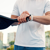 Hands, smart watch and padel with fitness, click and check stats for ...