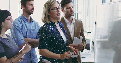 Plotting out her plan for the team | Buy Stock Photo on PeopleImages ...