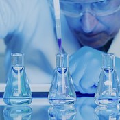 Closeup of laboratory scientist testing phenolphthalein chemical ...