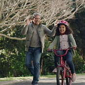 First ride, bike and happy child outdoors learning to cycle alone on a ...