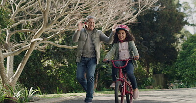 First ride, bike and happy child outdoors learning to cycle alone on a ...