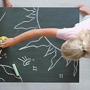 Creative, drawing and fun activity in a kids classroom with chalk and ...