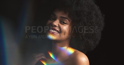 Prism rainbow, reflection and light on a black woman model in a ...
