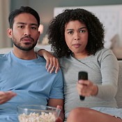 Arguing couple, tv remote and controlling woman changing the channel to ...